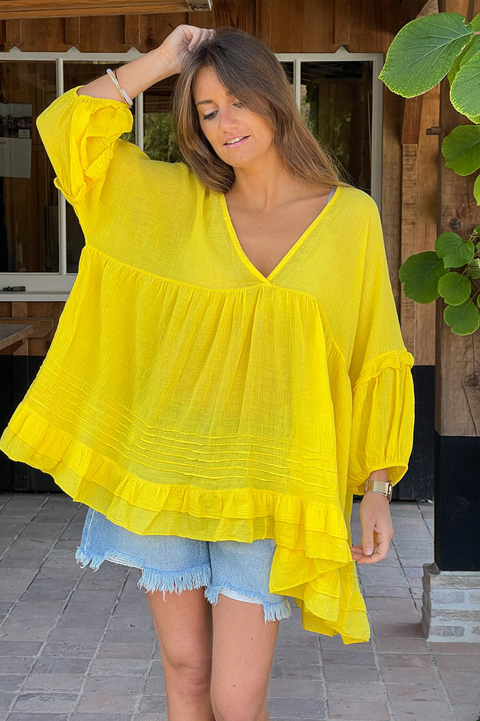 Tunique large jaune en voile de coton manches chauve souris détails ...